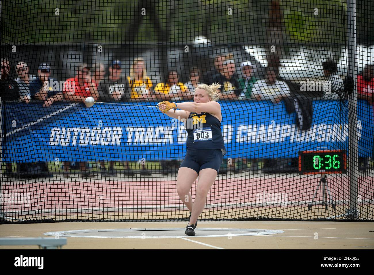 Michigan's Courtney Jacobsen (903) competes in the women's hammer throw ...