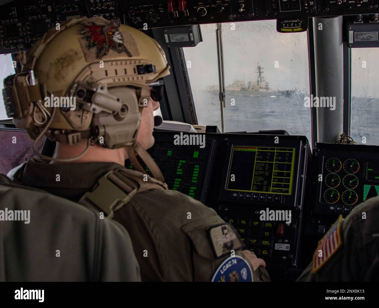 Aviation Electrician’s Mate 1st Class Trent Warren operates a landing ...