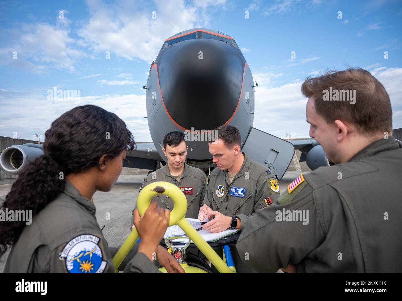 Aircrew assigned to the 909th Air Refueling Squadron review KC-135 ...