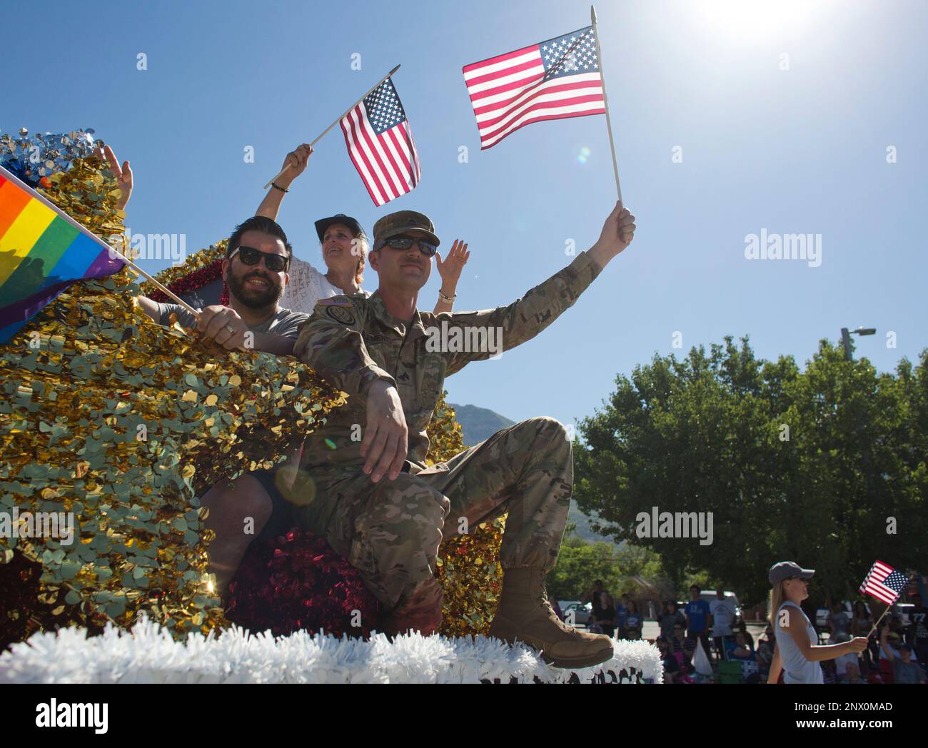 Participants in the Mormon Building Bridges float wave American and ...
