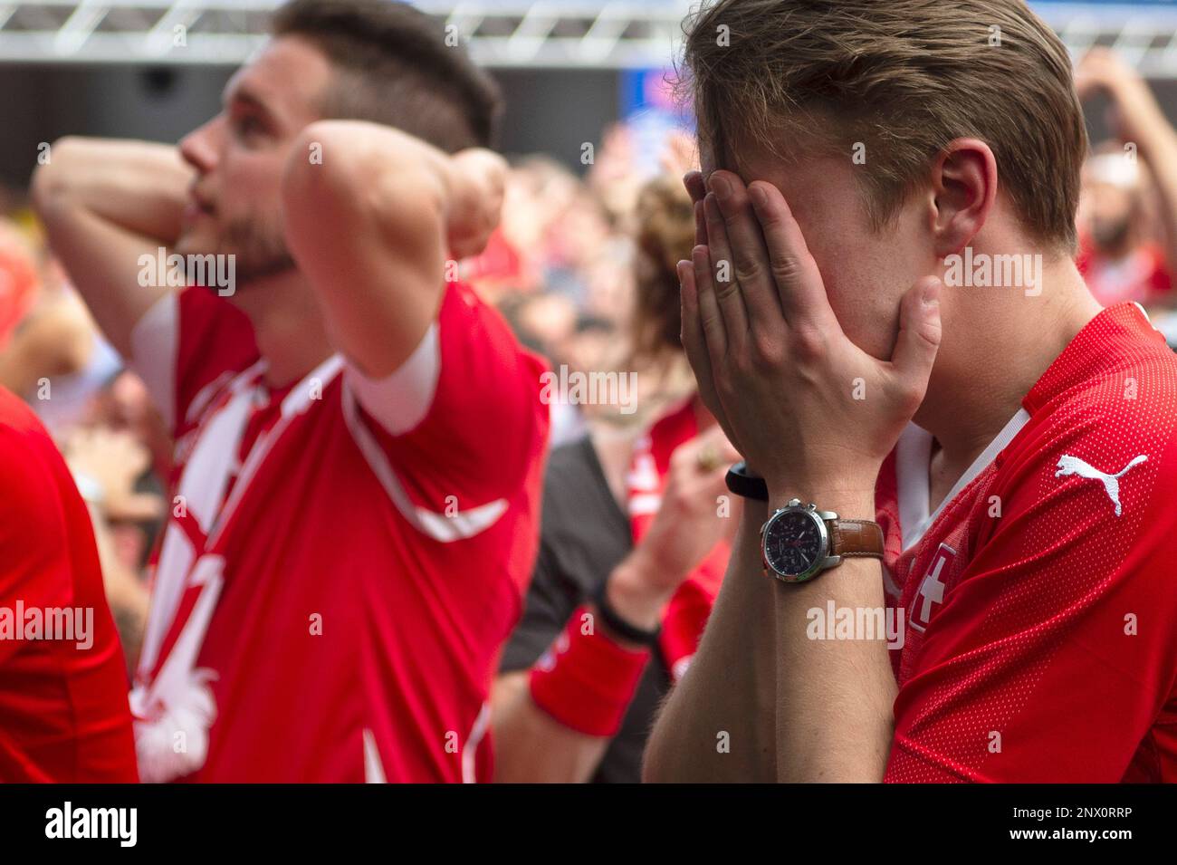Swiss supporters react as they watch a World Cup round of 16 soccer ...