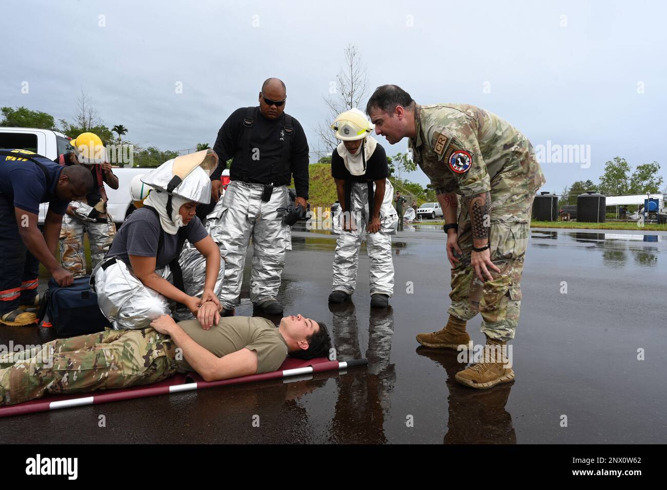 Palau International Fire fighters check for a pulse on a U.S. Air Force ...