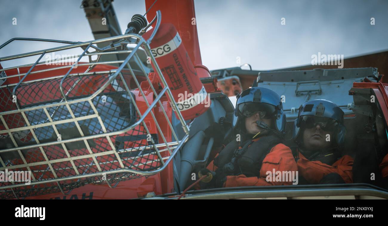 A U.S. Coast Guard Eurocopter MH-65 Dolphin Helicopter crew from Air ...