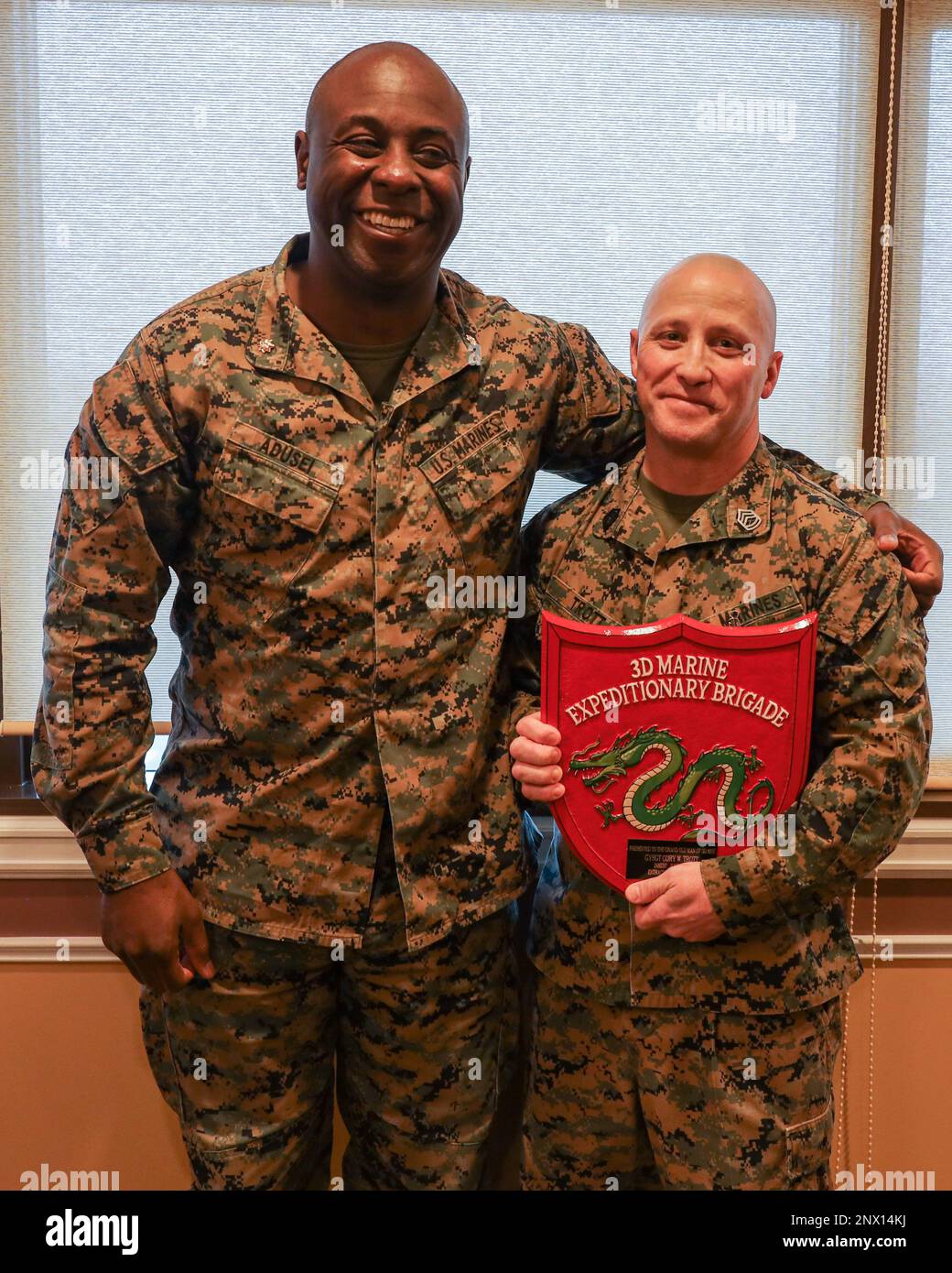 U.S. Marine Major Jeff Adusei, an air supply officer, left, poses for a ...