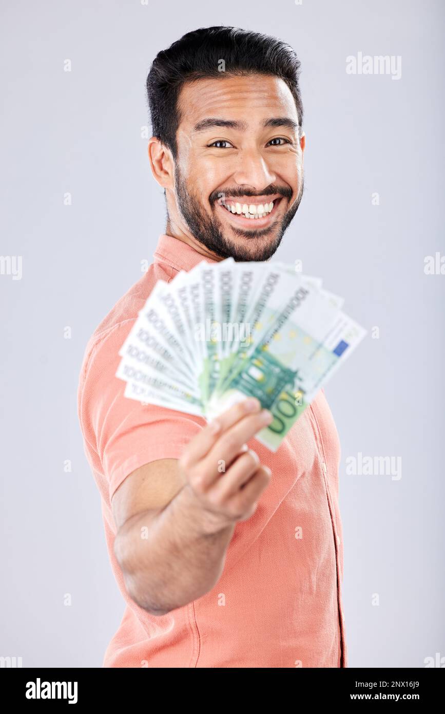 Showing, rich and portrait of Asian man with money isolated on a grey ...