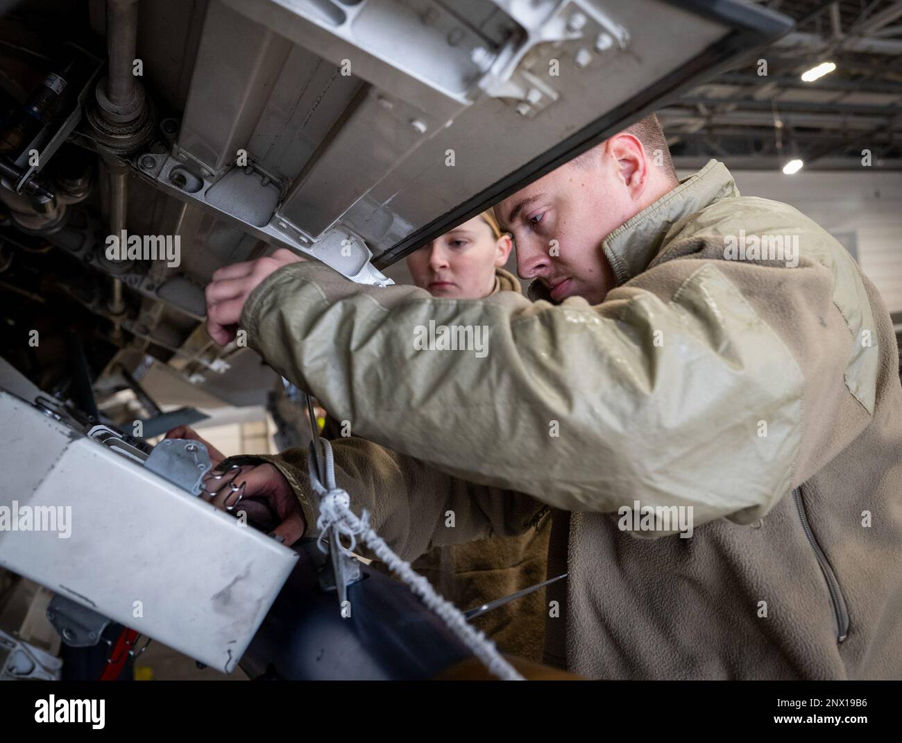 A 43rd Fighter Generation Squadron weapons load crew ensures an AIM-9 ...