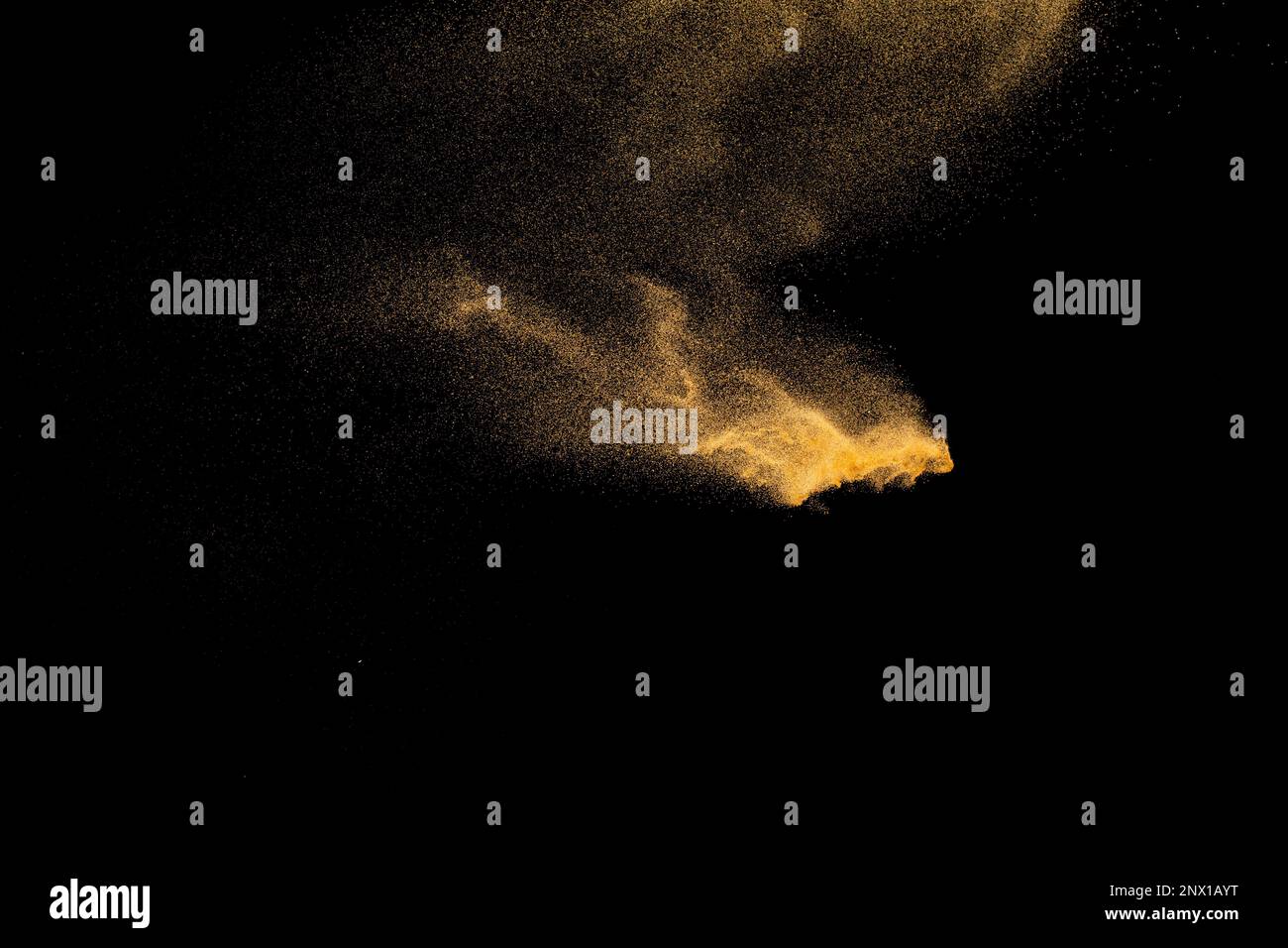 Sand explosion isolated on black background. Freeze motion of sandy ...