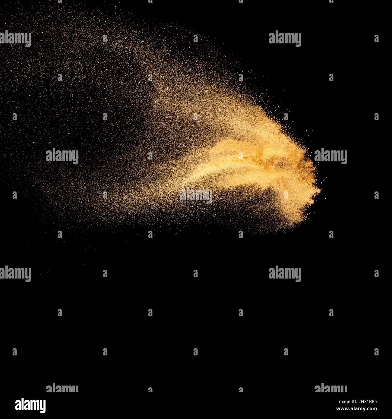 Sand explosion isolated on black background. Freeze motion of sandy ...