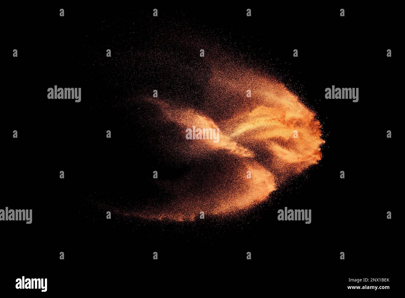 Sand explosion isolated on black background. Freeze motion of sandy ...