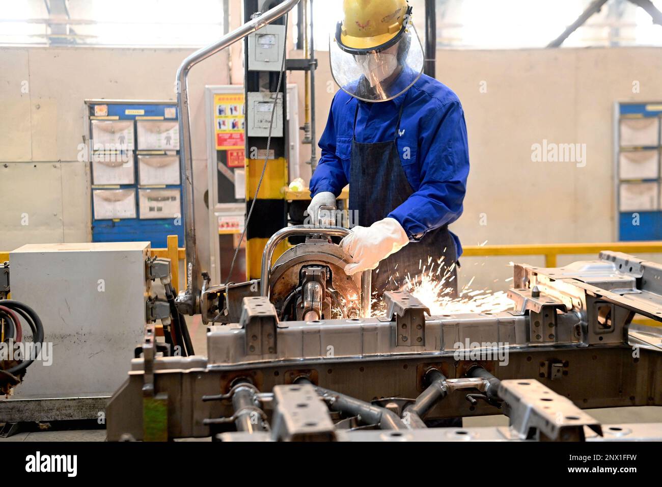 QINGDAO, CHINA - FEBRUARY 1, 2023 - Production line employees weld auto ...
