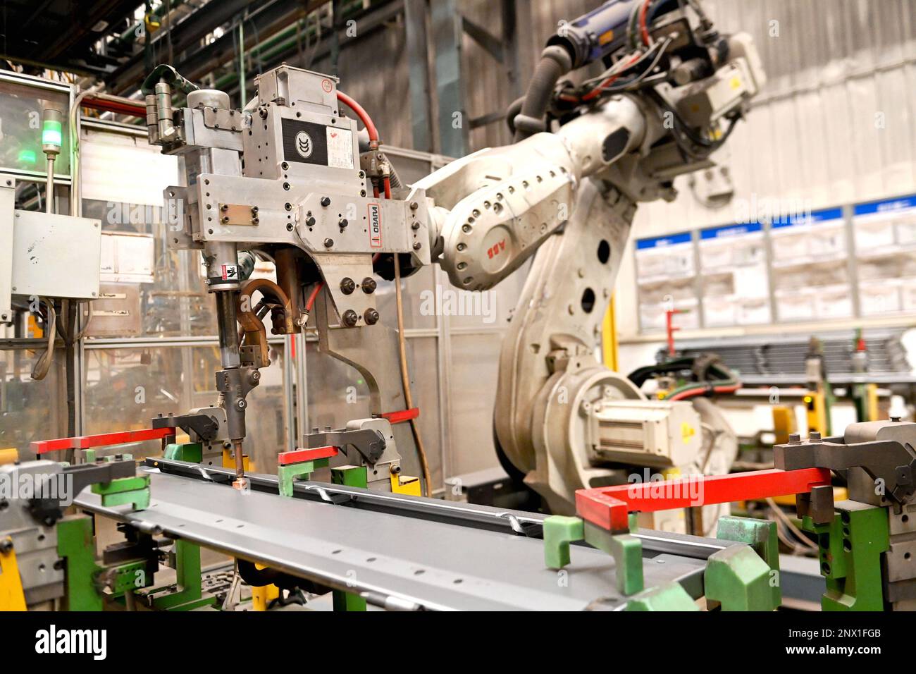 QINGDAO, CHINA - FEBRUARY 1, 2023 - A robot arm welds auto parts at a ...