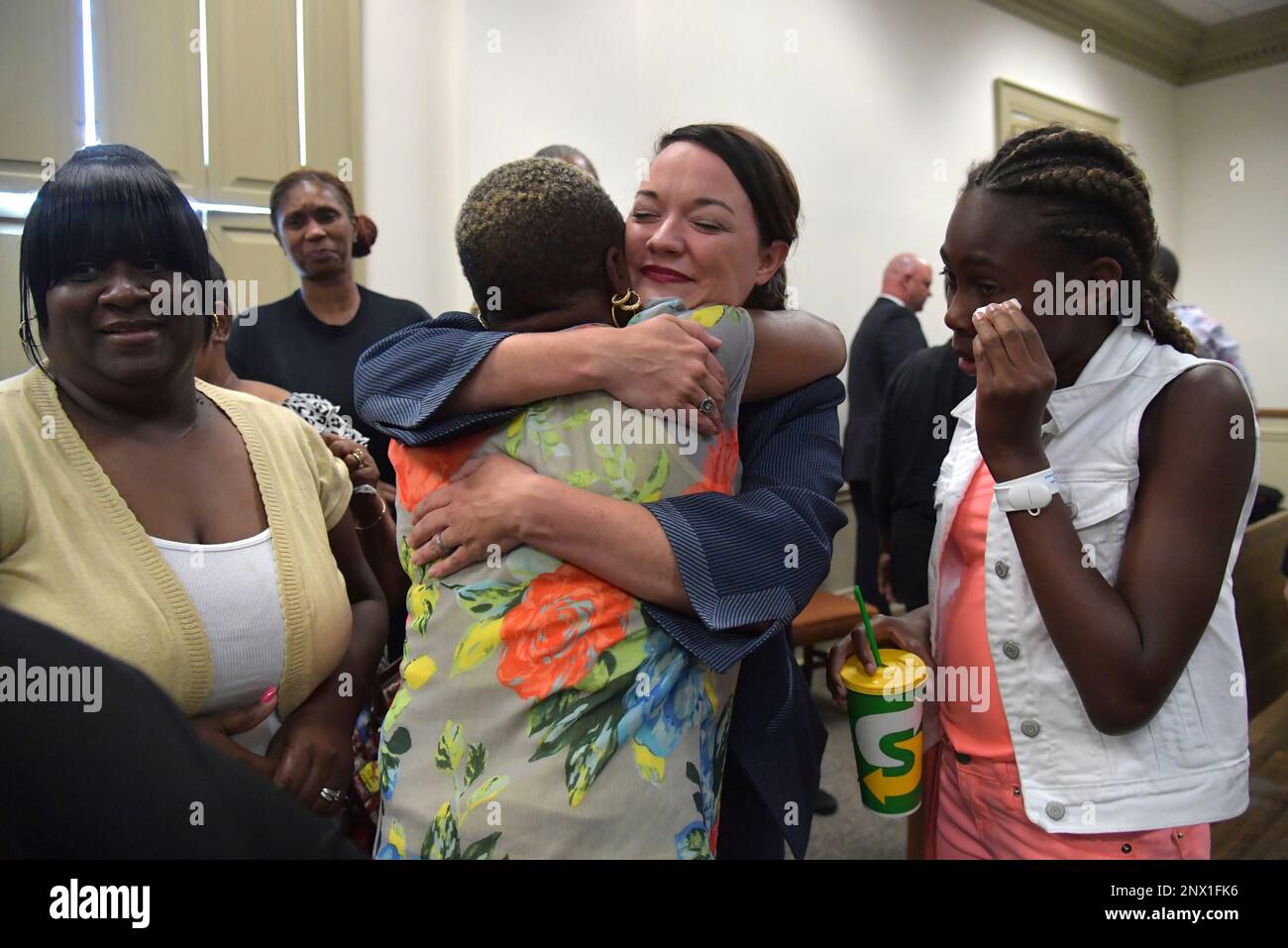 Assistant District Attorney Marie Broder, center, celebrates with ...