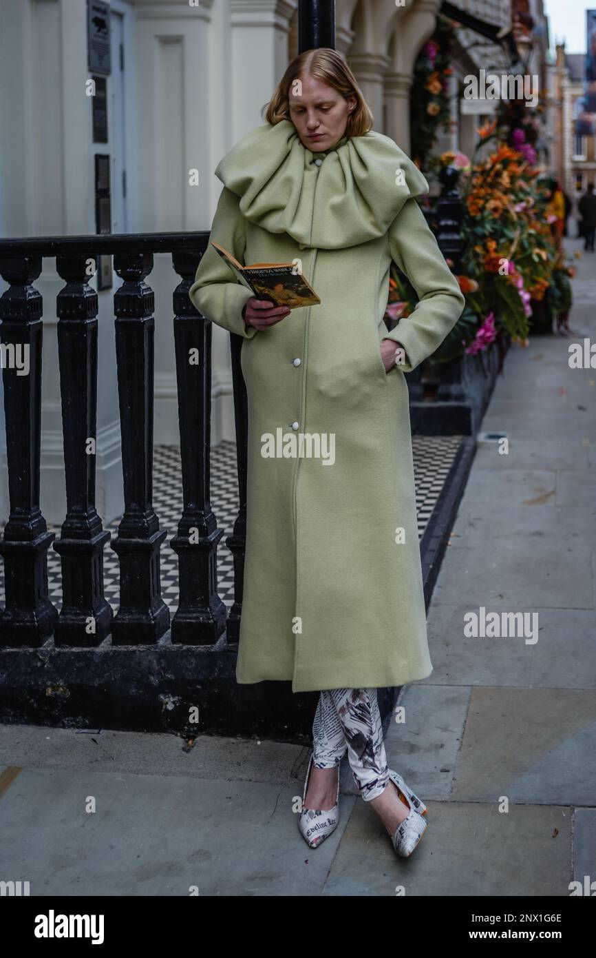 A model reads Virginia Woolf at Edeline Lee's Fall 2023 Ready-to-Wear ...
