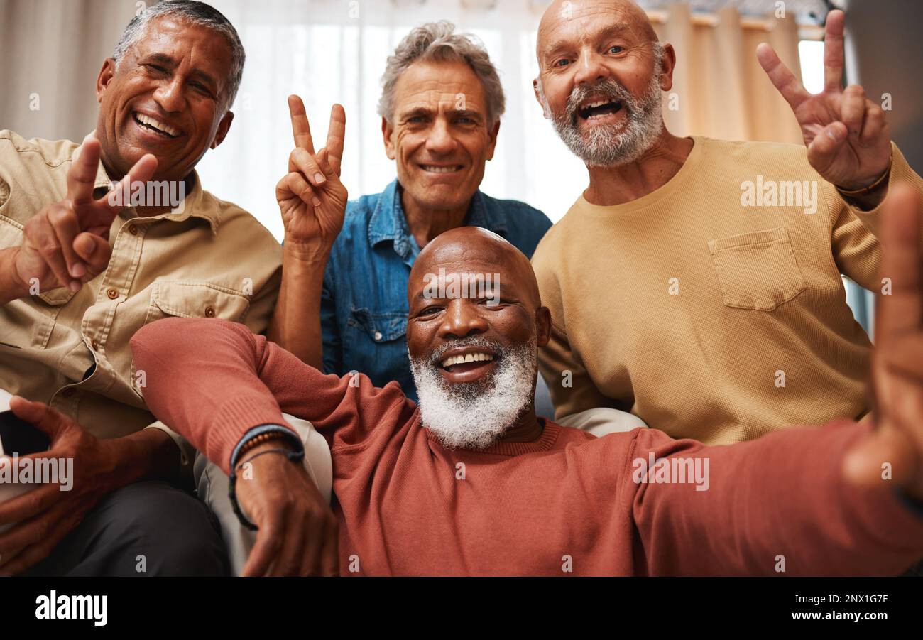 Portrait, selfie and senior friends with peace sign in house, having ...