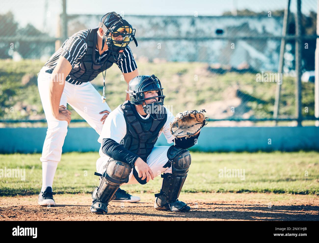 Sports, umpire and baseball with man on field for fitness, training and ...