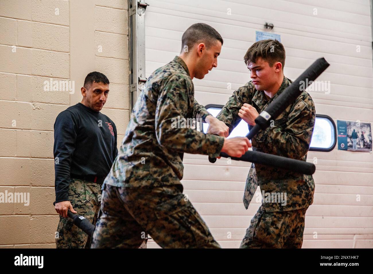 U.S. Marine Corps 1stLt. Thomas R. Grover, left, a deputy staff judge ...