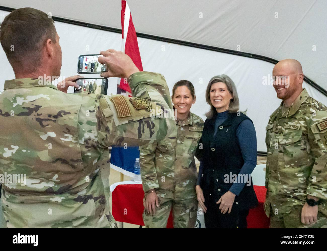 U.S. Sen. Joni Ernst of Iowa poses with U.S. Airmen during a visit to ...