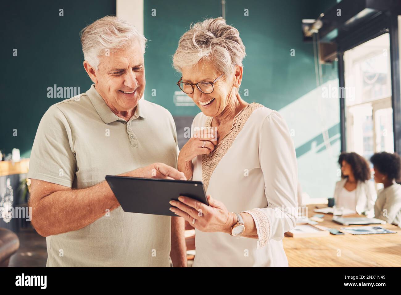 Senior, tablet and collaboration by elderly colleagues or employees in ...