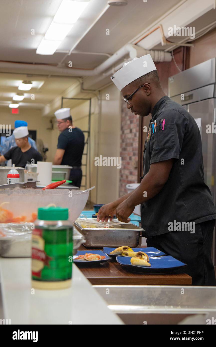 U.S. Marine Corps Lance Cpl. Rashaud Walker, a food service specialist ...