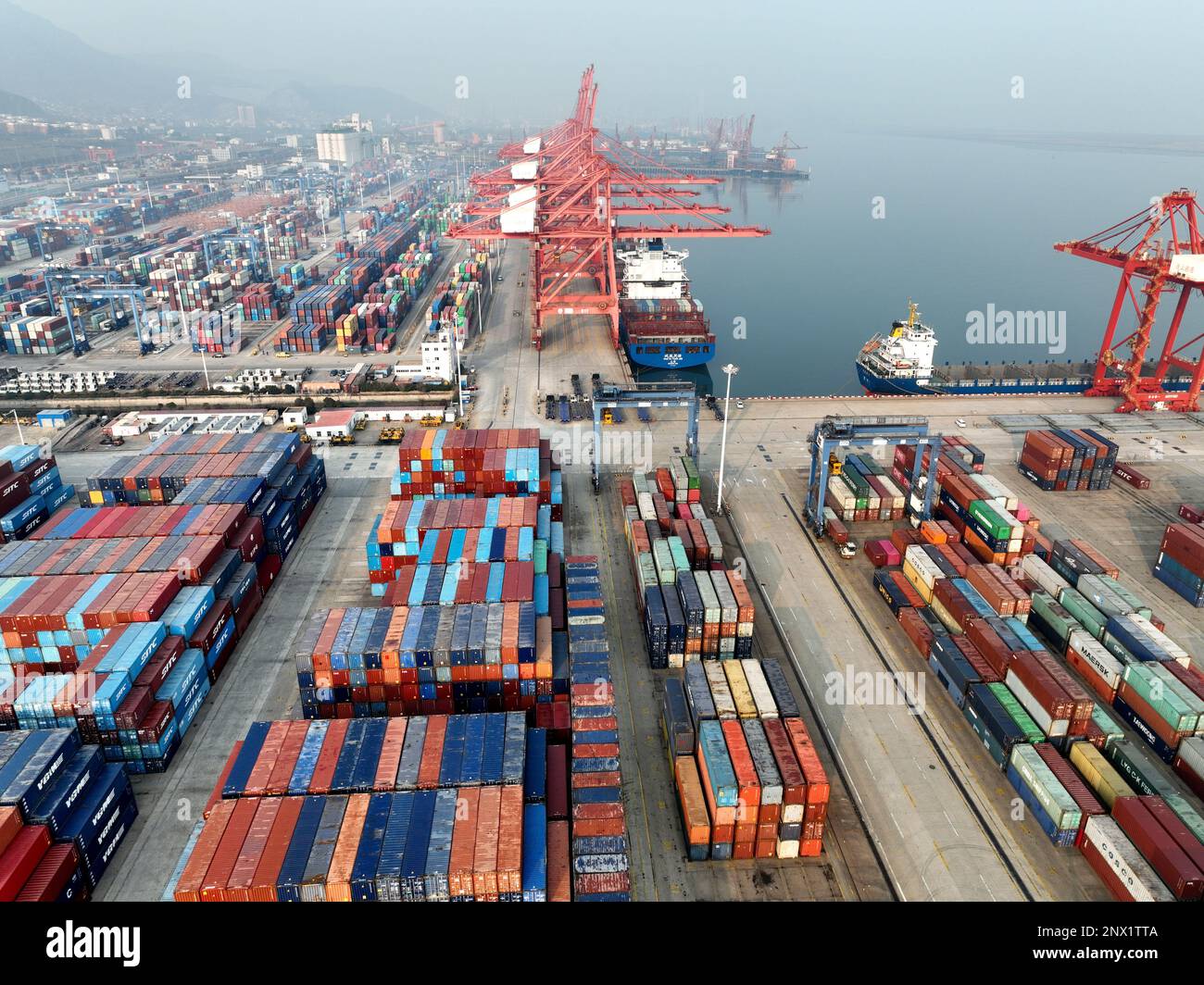 LIANYUNGANG, CHINA - FEBRUARY 1, 2023 - Ocean cargo ships load and ...