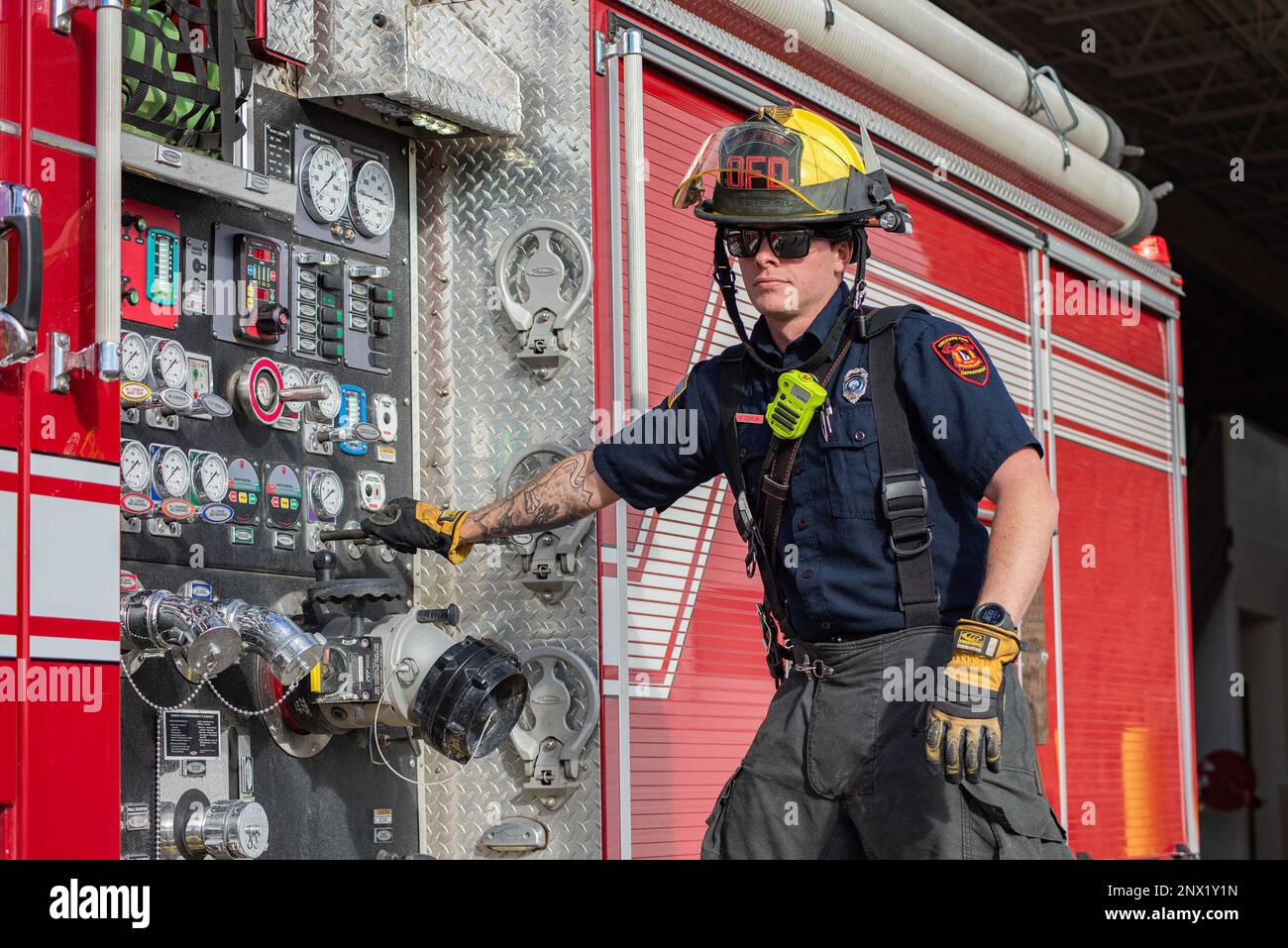 Firefighter Matt Conklin conducts routine maintenance on a fire engine ...
