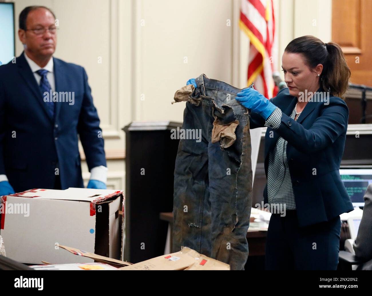 Larry Peterson, left, GBI forensic investigator, watches as Marie ...