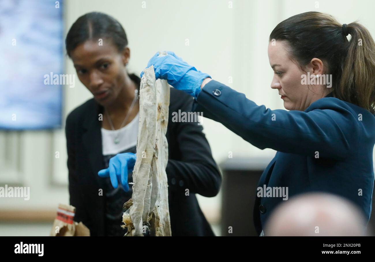Daniellla Stuart, left, a GBI special agent and crime scene specialist ...