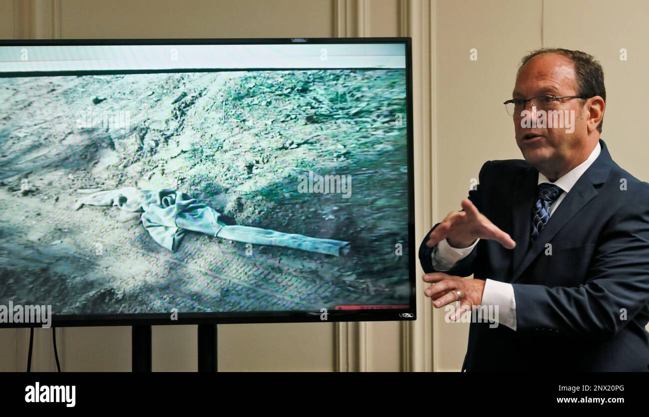 Larry Peterson, a GBI forensic investigator, testifies about photos ...