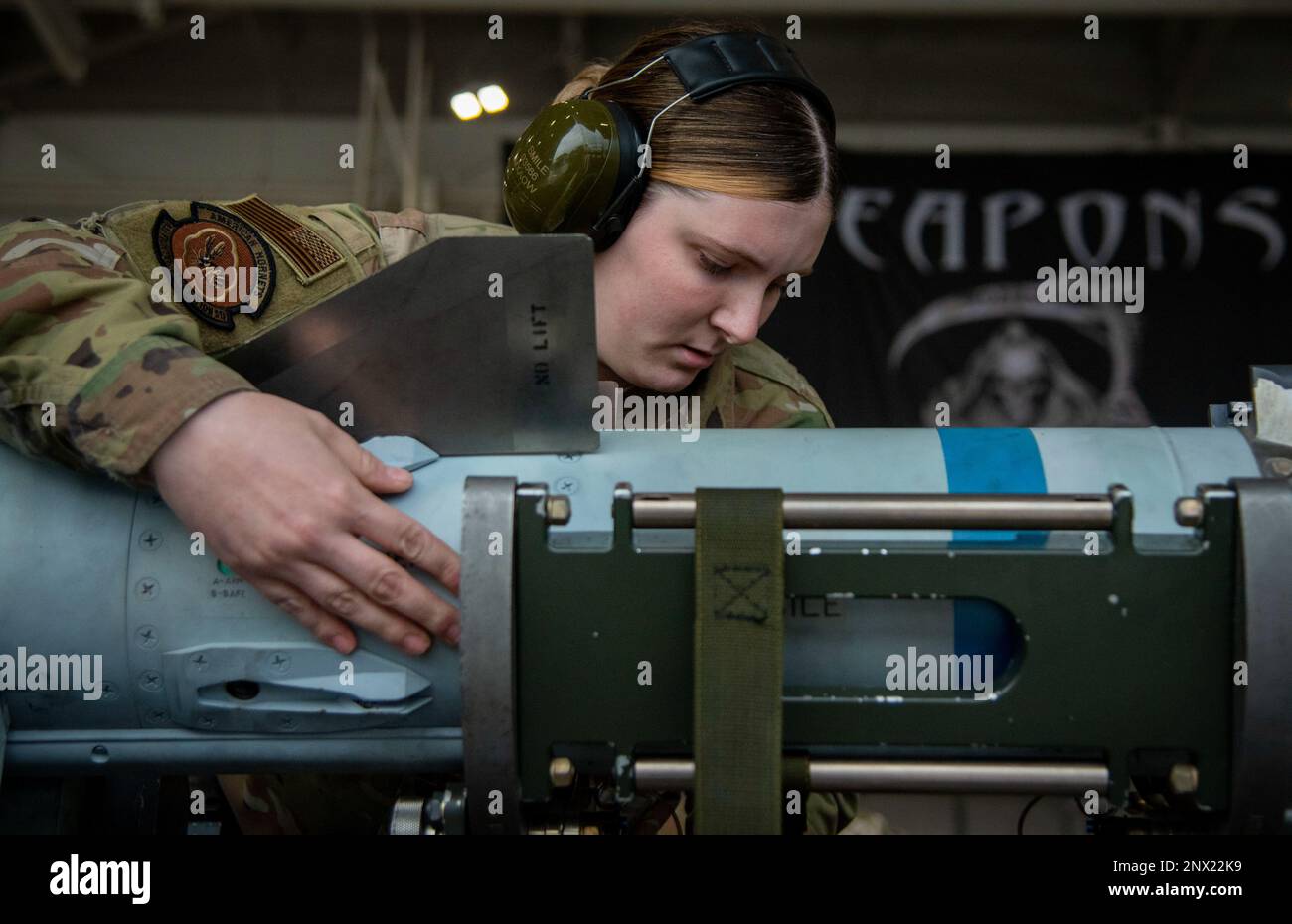 Staff Sgt. Kayla Smiley, 43rd Fighter Generation Squadron, secures an ...