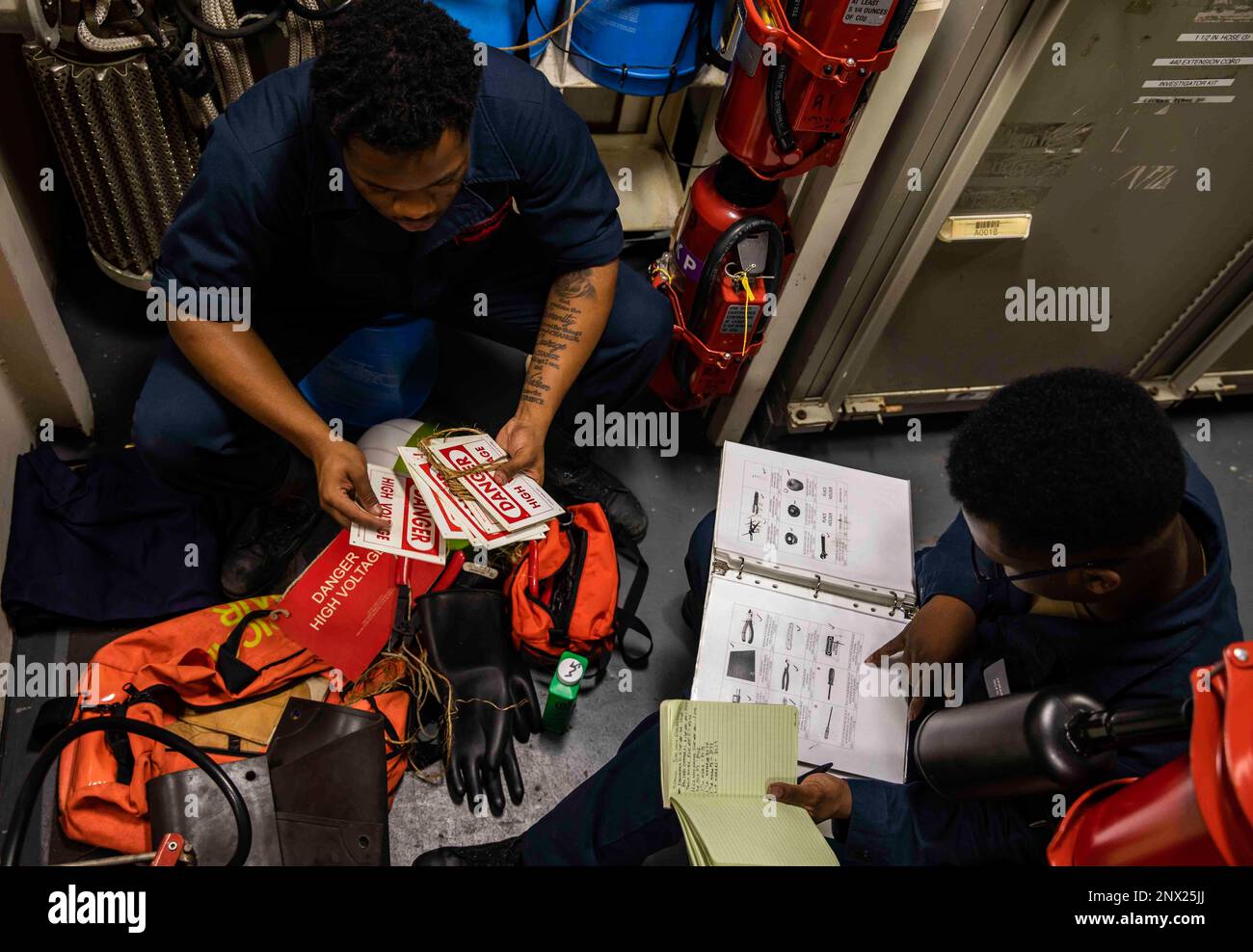 230104-N-XK047-1036 Fireman Jermaine Washington, left, and Damage ...