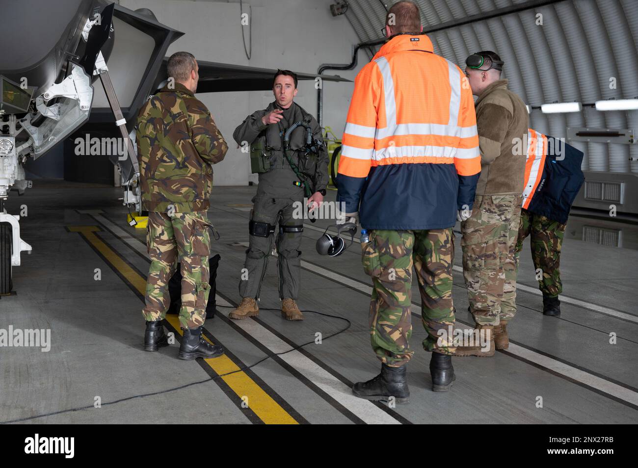 Royal Netherlands Air Force personnel debrief a U.S. Air Force pilot ...