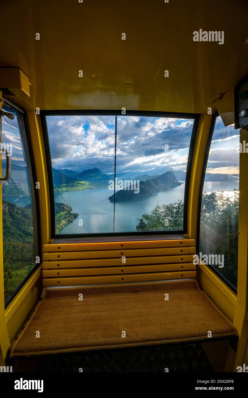 A cable car photographed from inside, from the window view you see a ...