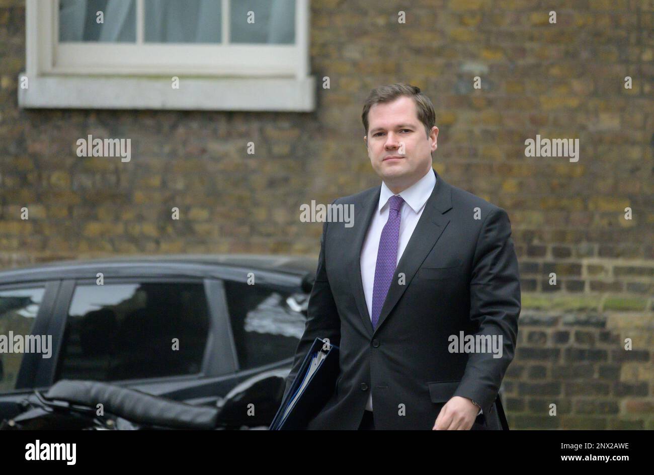 Robert Jenrick MP (Minister for Immigration) arriving in Downing Street ...