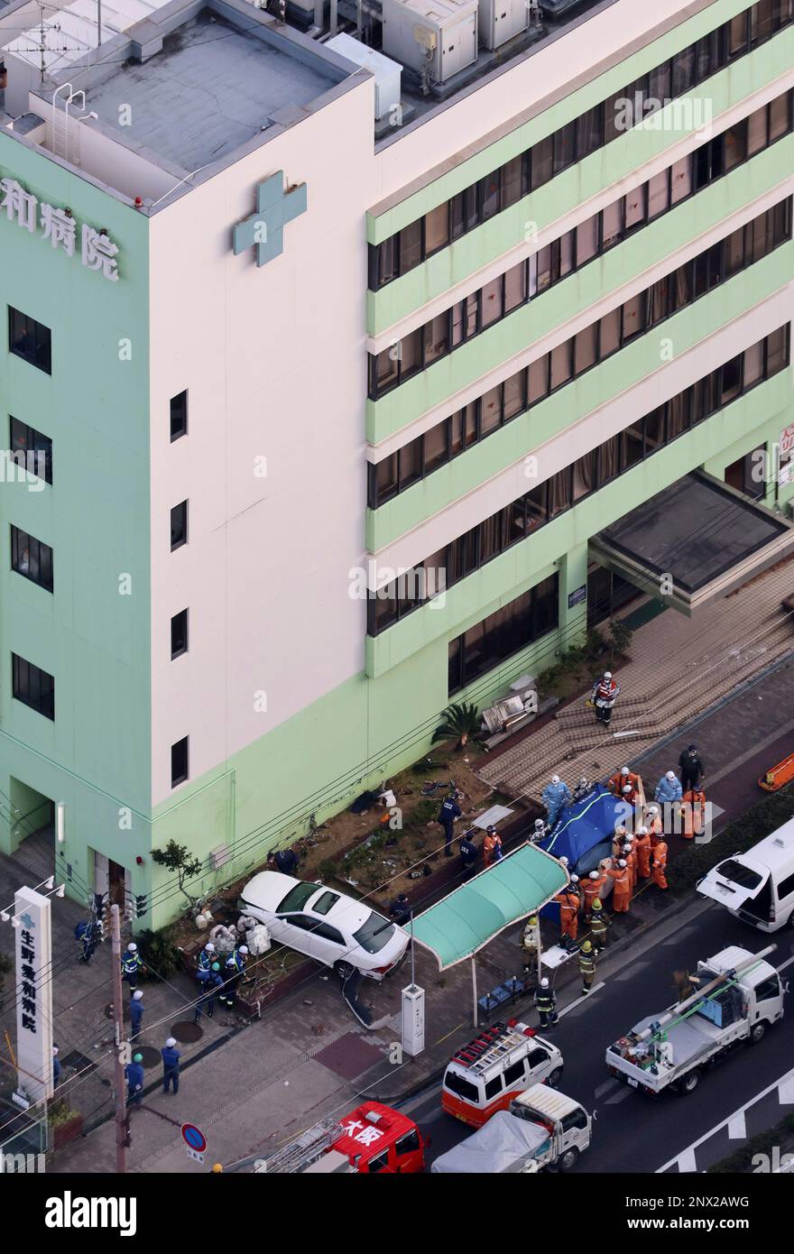 An aerial photo shows an automobile crashing into IkunoAiwa Hospital in ...