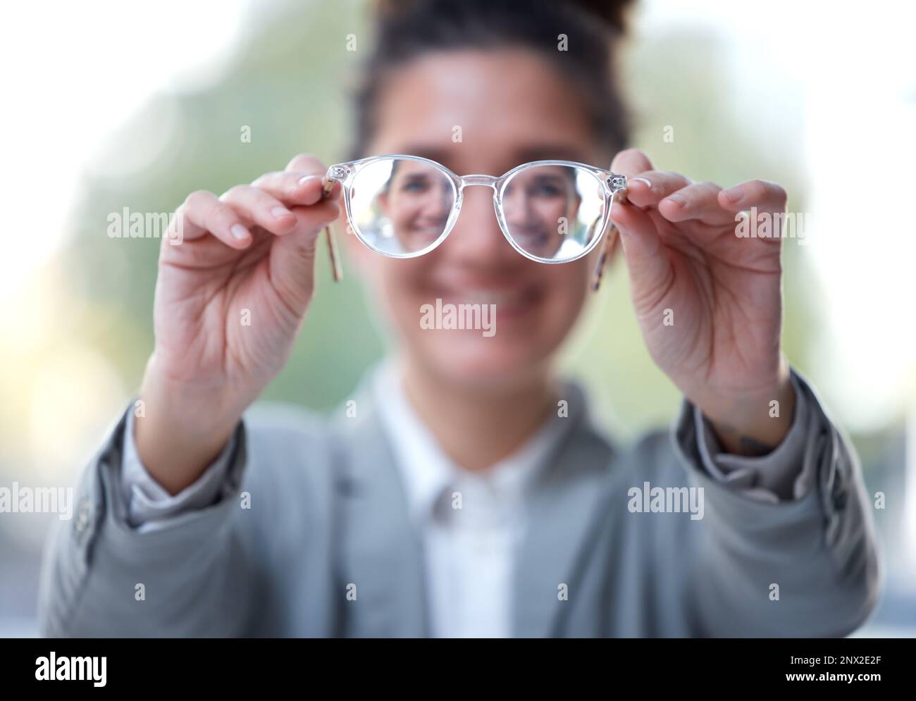Business woman, vision and glasses in hands, face reflection and focus ...