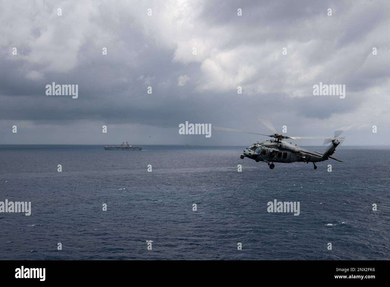 230215-N-ZQ263-1252 SOUTH CHINA SEA (Feb. 15, 2023) An MH-60S Sea Hawk ...