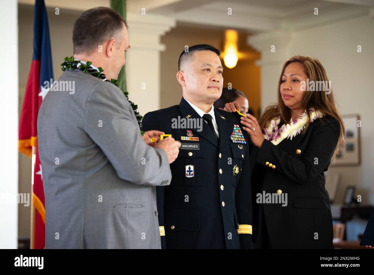 U.S. Army Maj. Gen. Roy Macaraeg is pinned to his new rank by Josh Green, Hawaii State Governor ...