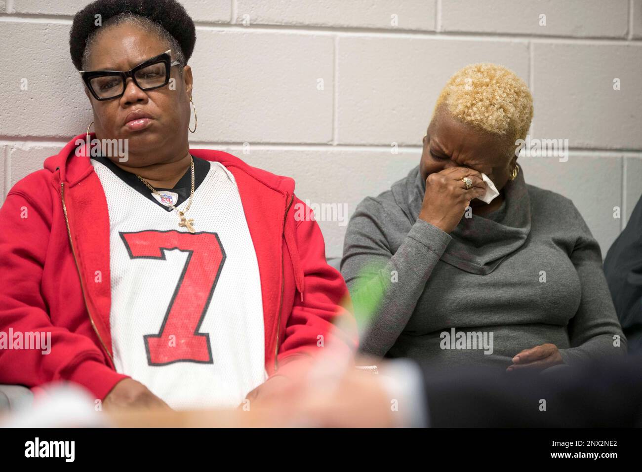 Supporters of Timothy Coggins become emotional during a preliminary ...