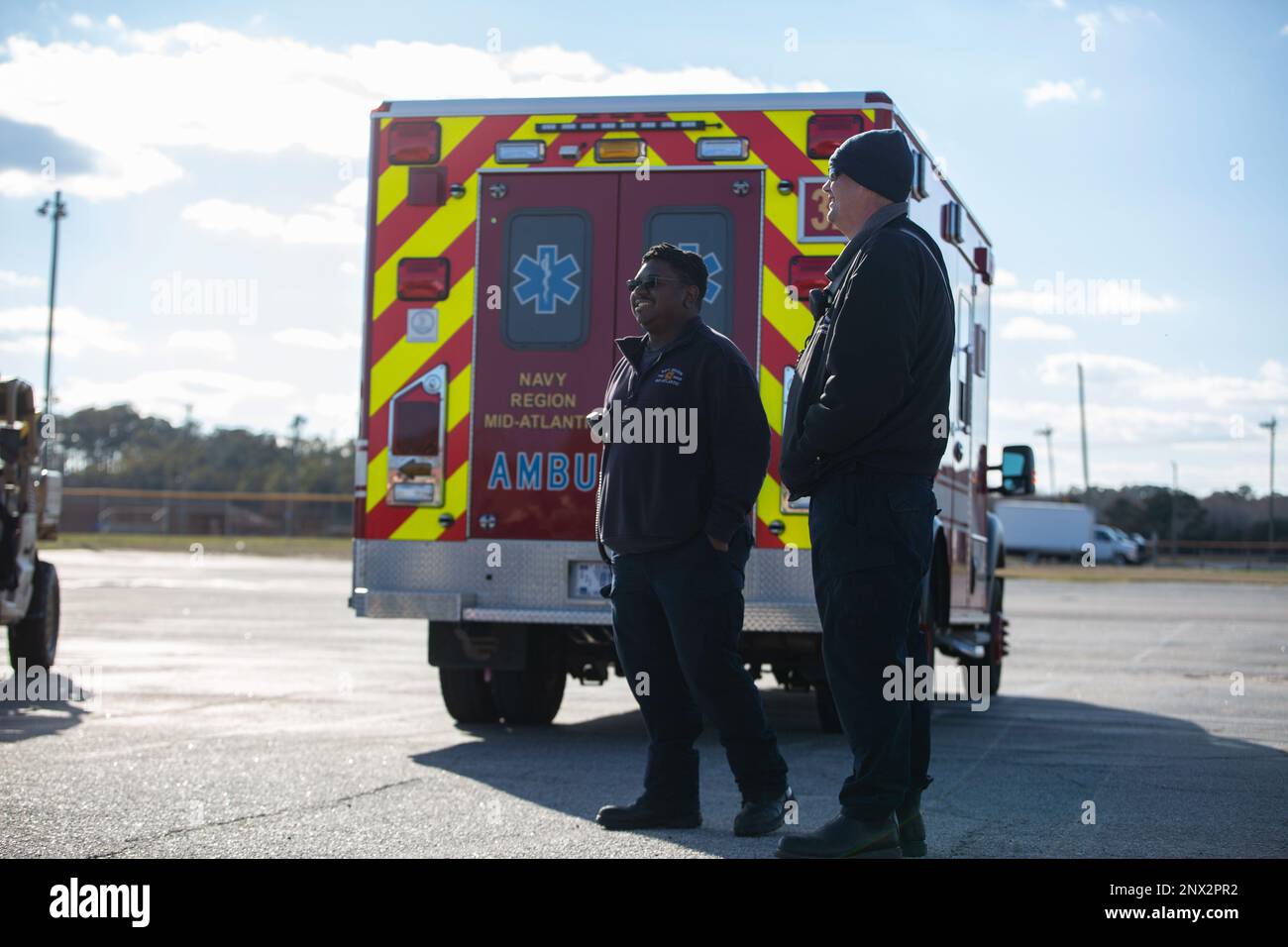Emergency medical technicians with Navy Region Mid-Atlantic stand by ...