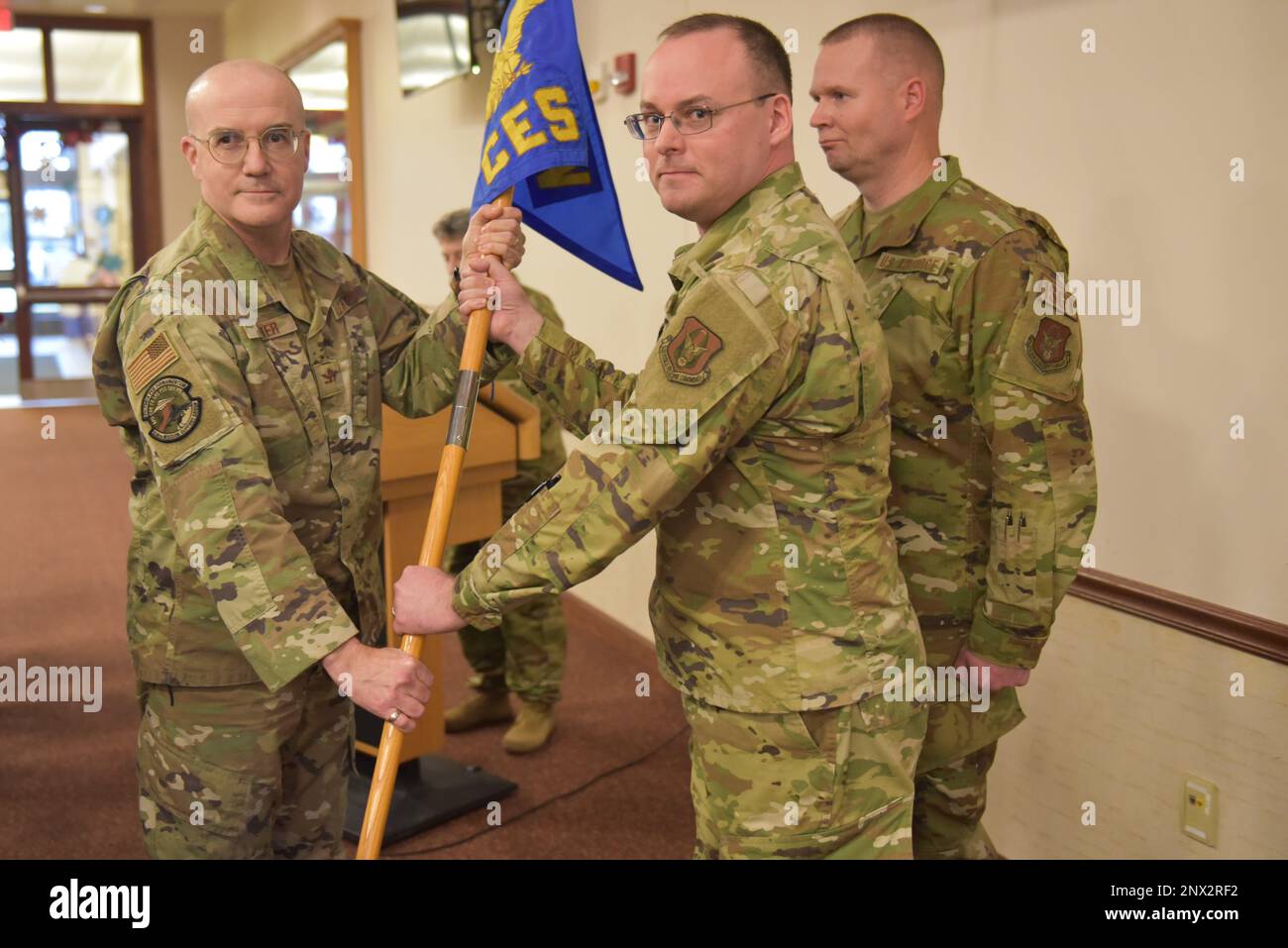 Lt Col Donald Harper (center) accepts the 914th Civil Engineer Squadron ...