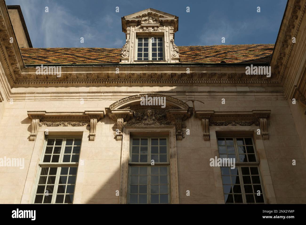 Ancient building with decorated windows, France Stock Photo - Alamy