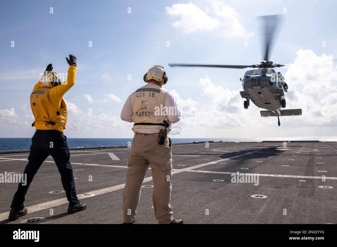 230117-N-HG846-1113 SOUTH CHINA SEA (January 17, 2023) – Sailors direct ...