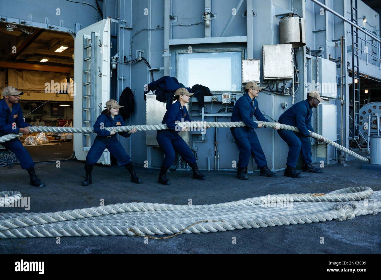 PACIFIC OCEAN (Jan. 23, 2023) Sailors heave lines during a sea and ...