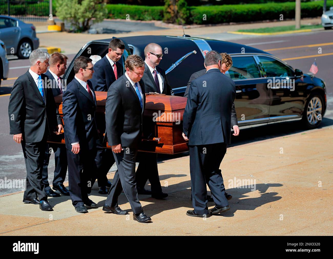 Pallbearers carry the casket of baseball Hall of Famer Red Schoendienst ...