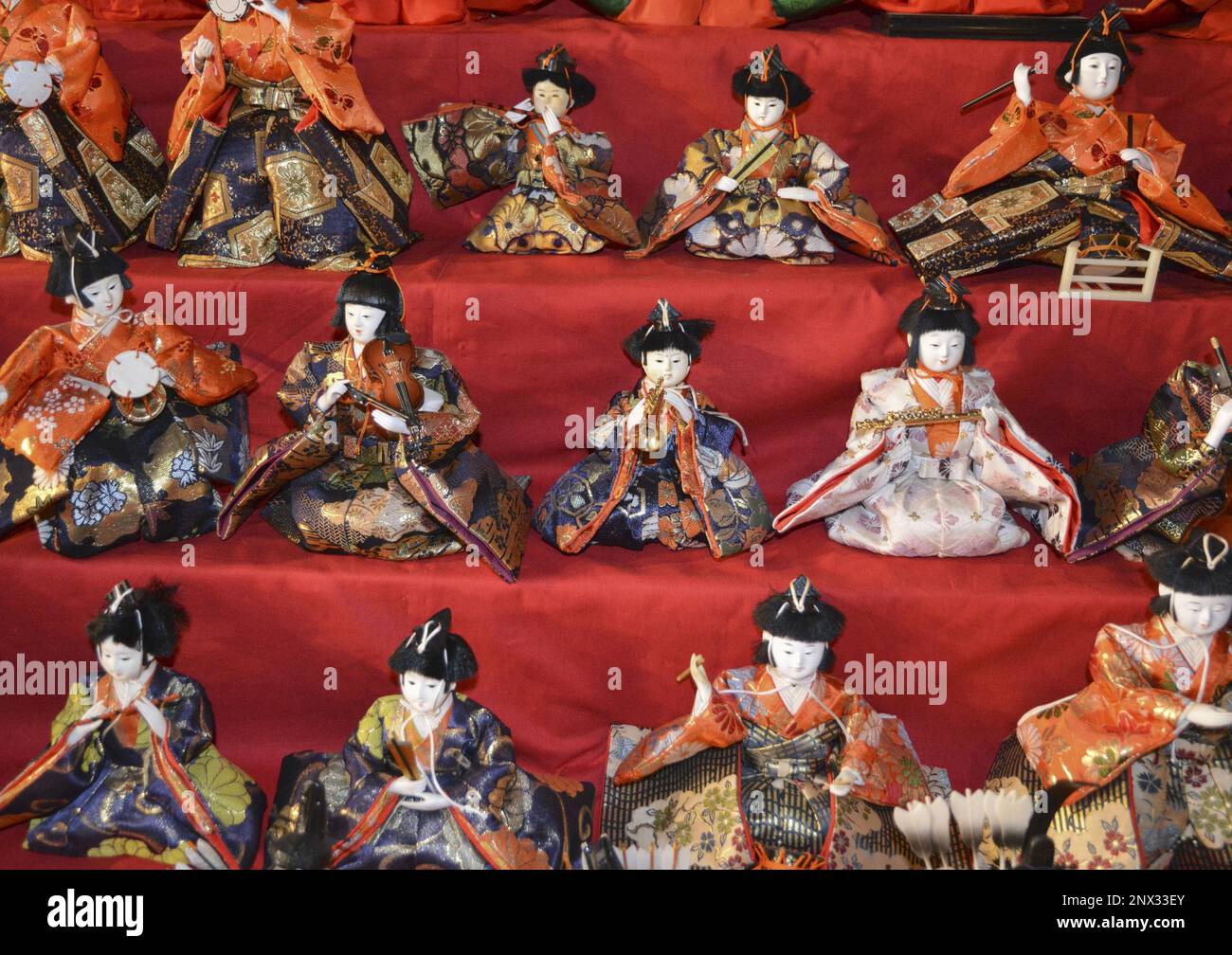 Hina dolls playing musical instruments are displayed during a seasonal ...