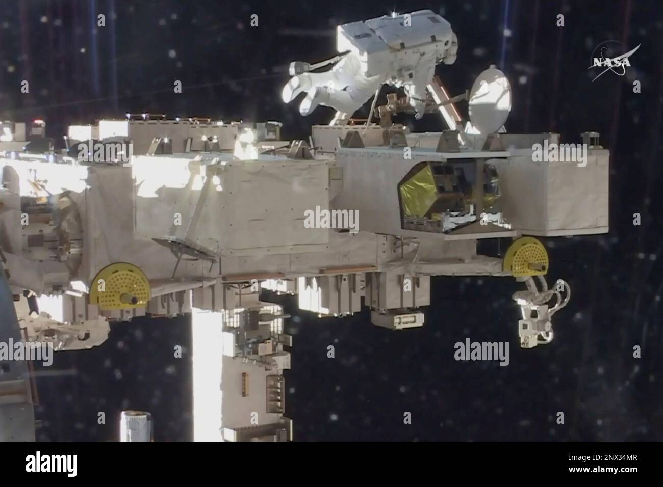 In this image from video made available by NASA, astronaut Drew Feustel ...