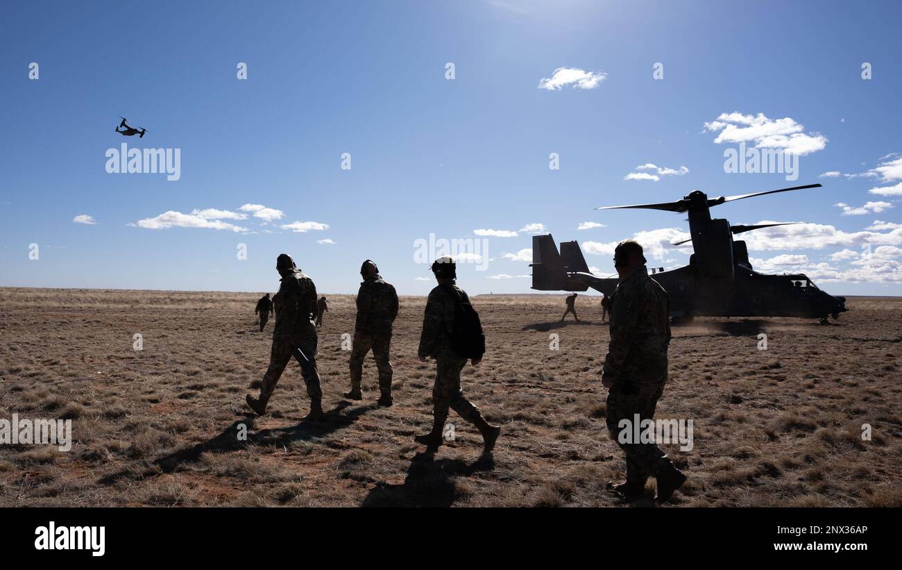 U.S Air Force members walk towards a CV-22 Osprey assigned to the 20th ...