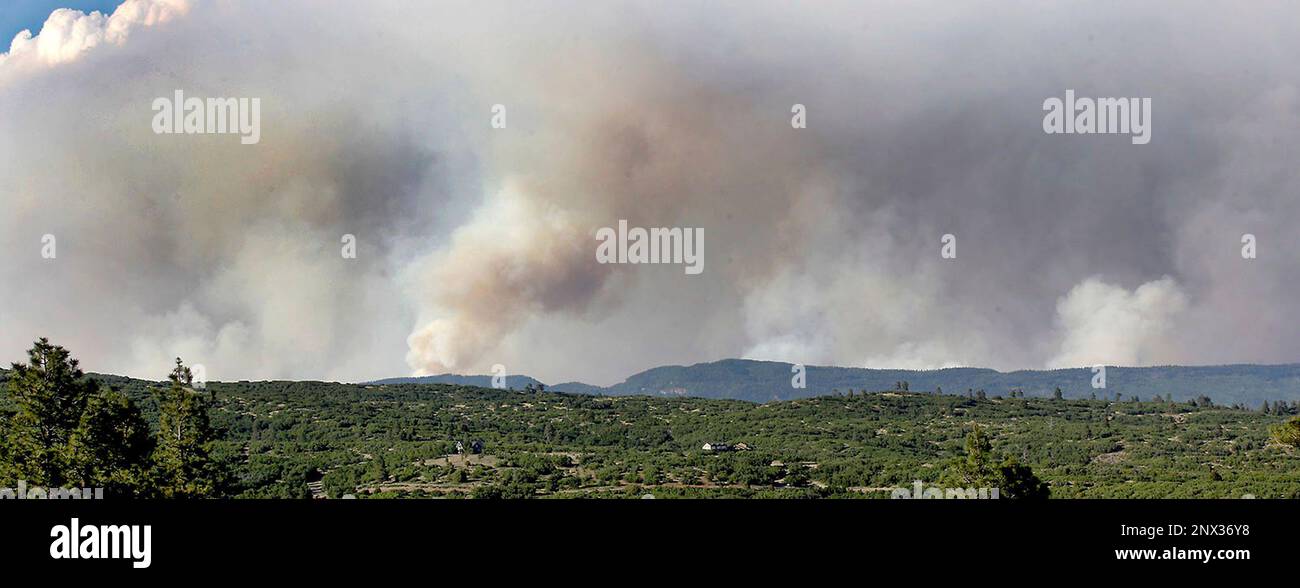 In this Tuesday, June 12, 2018, photograph, the view of fire plumes ...