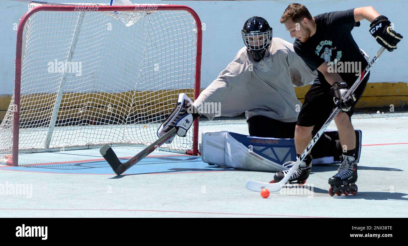 Billy Spear, a member of the Hazleton Street Hockey League, tries to ...