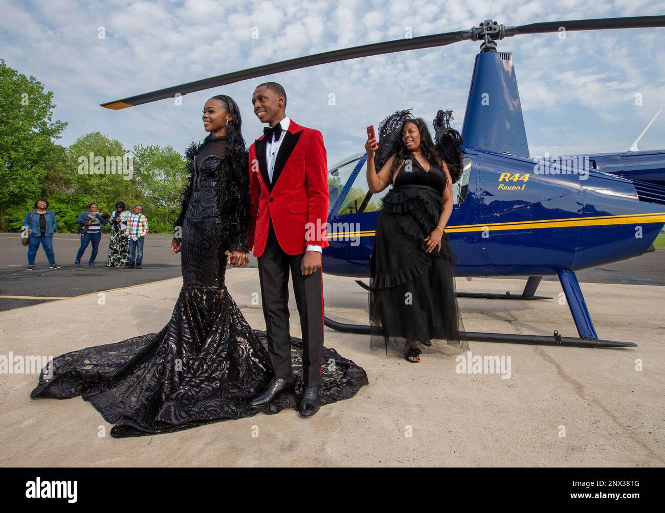 Saudia Shuler, right, films her son, Nieme Brooker with his date Tiana ...